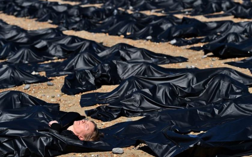 Body bags on Brighton beach: Amnesty UK stages protest urging ...
