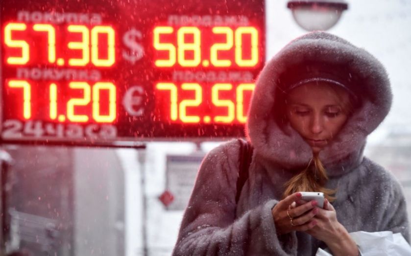 Rouble plummets against the dollar as Russian central bank makes shock ...