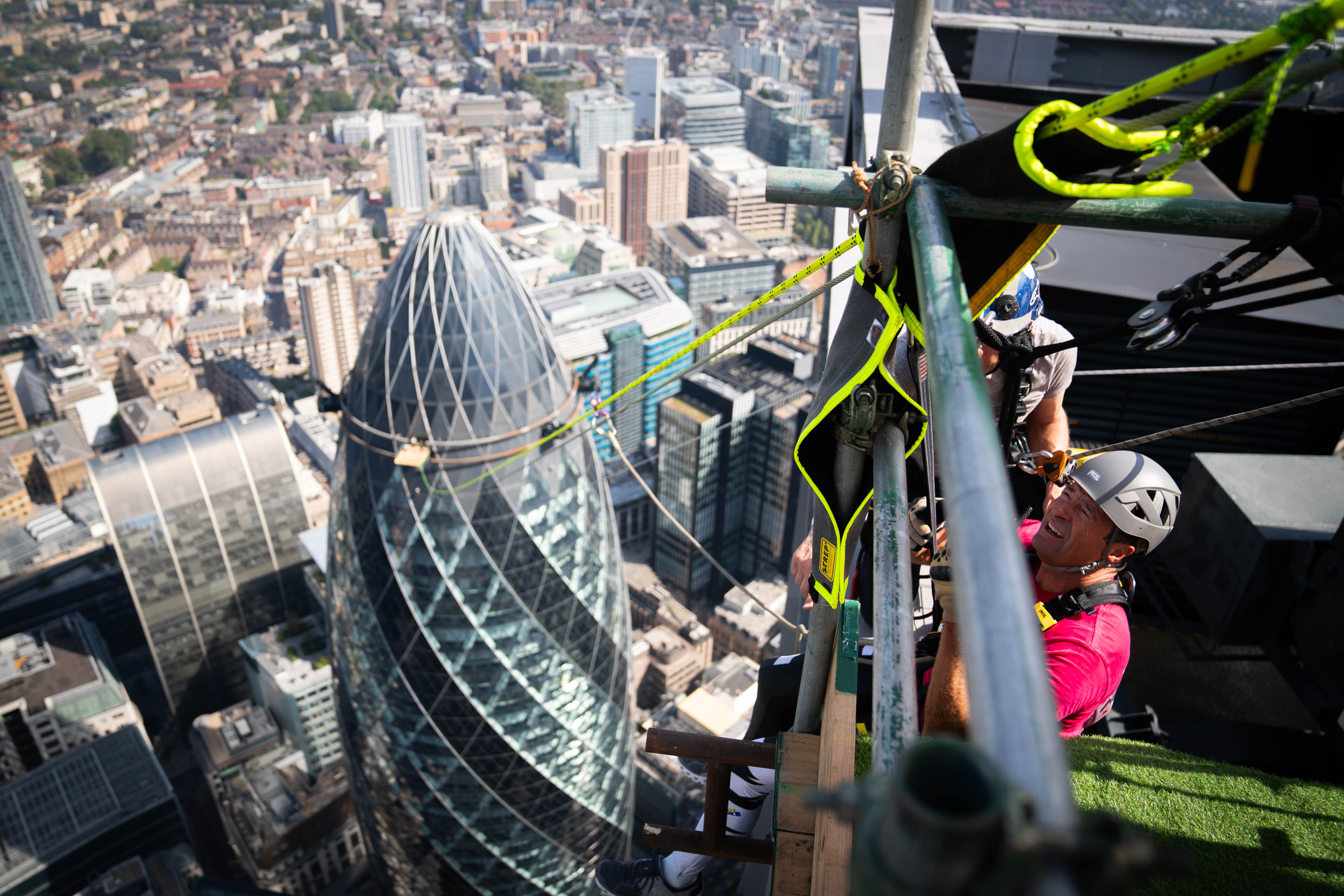 Skyscraper challenge: Hundreds of adrenaline junkies abseil and zipwire ...